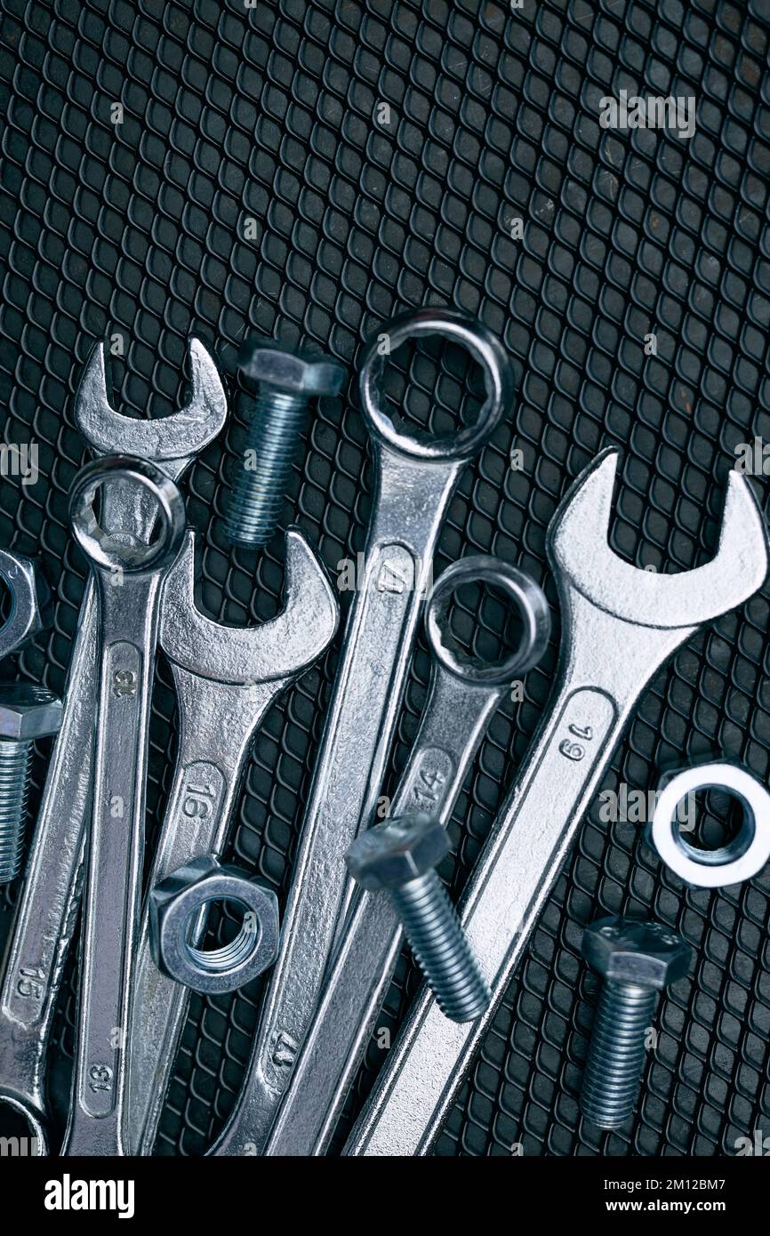 Set of chrome wrenches on steel surface. Mechanic tools for maintenance ...