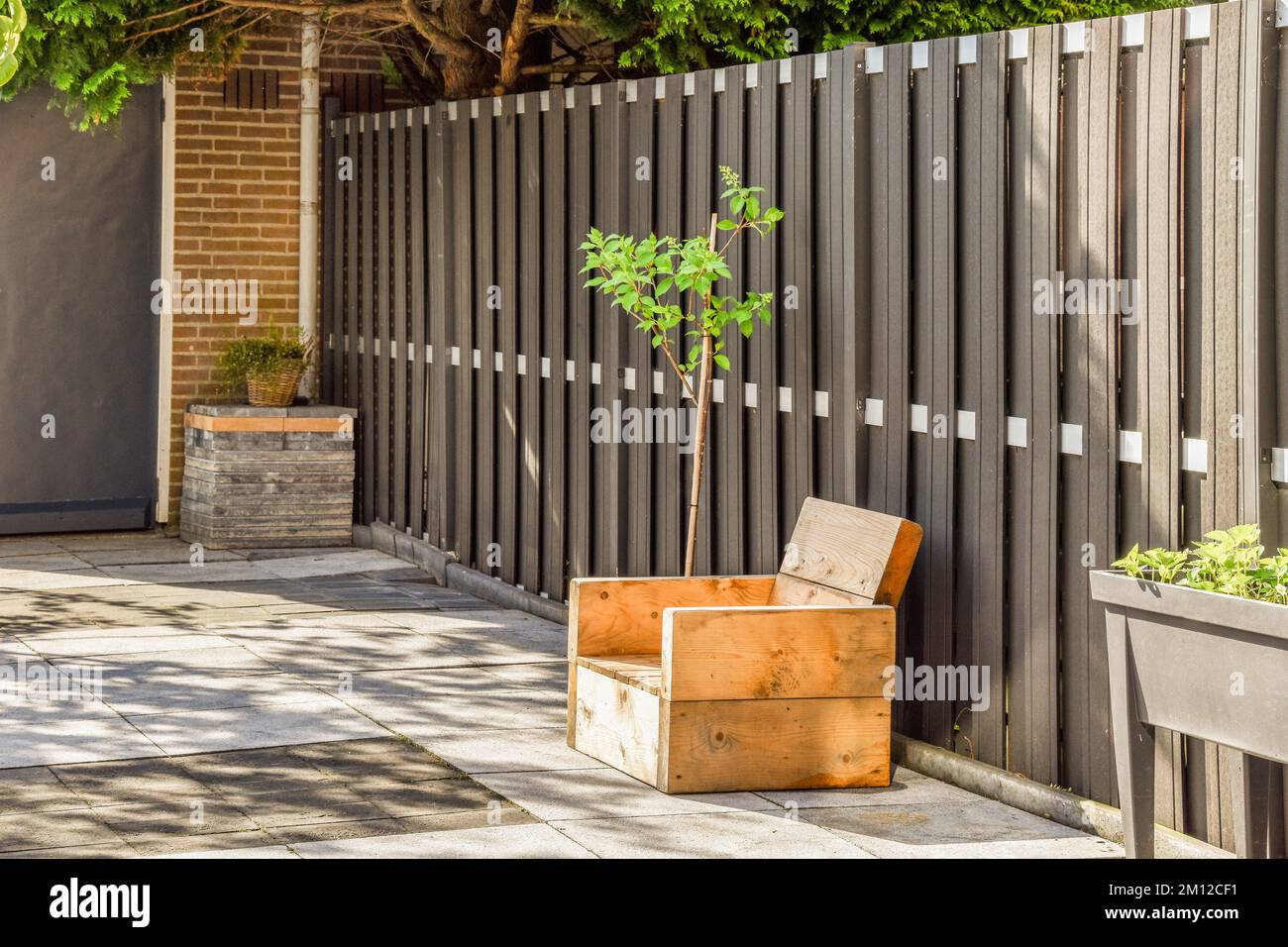 Tree growing into fence hi-res stock photography and images - Alamy