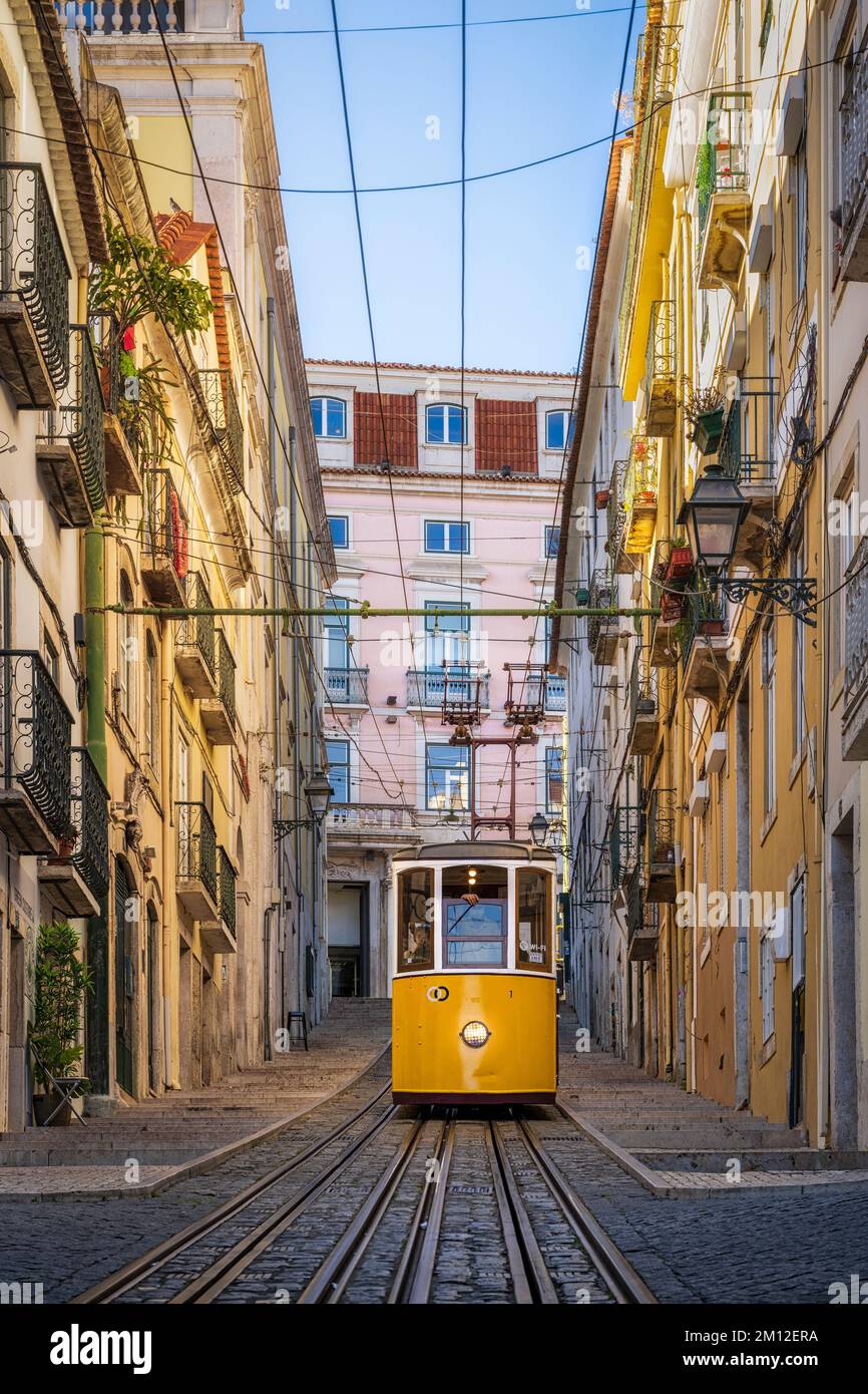 Historic yellow tram in a steep street in Lisbon, Portugal Stock Photo ...