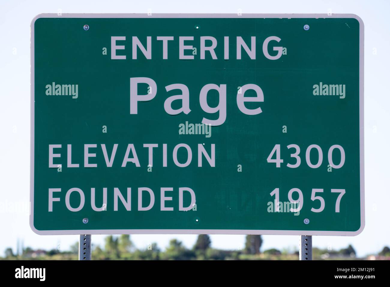 The green city limits sign entering Page, Arizona Stock Photo - Alamy