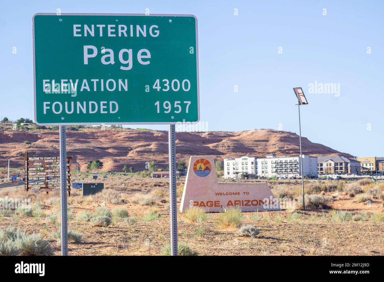 The green city limits sign entering Page, Arizona Stock Photo - Alamy