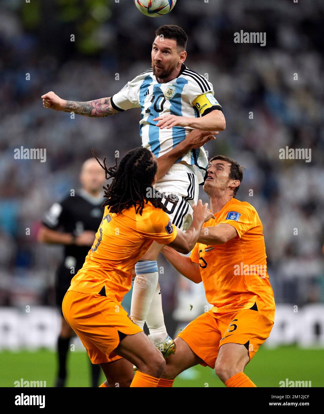 Argentina's Lionel Messi(centre) battles with Netherlands' Nathan Ake ...
