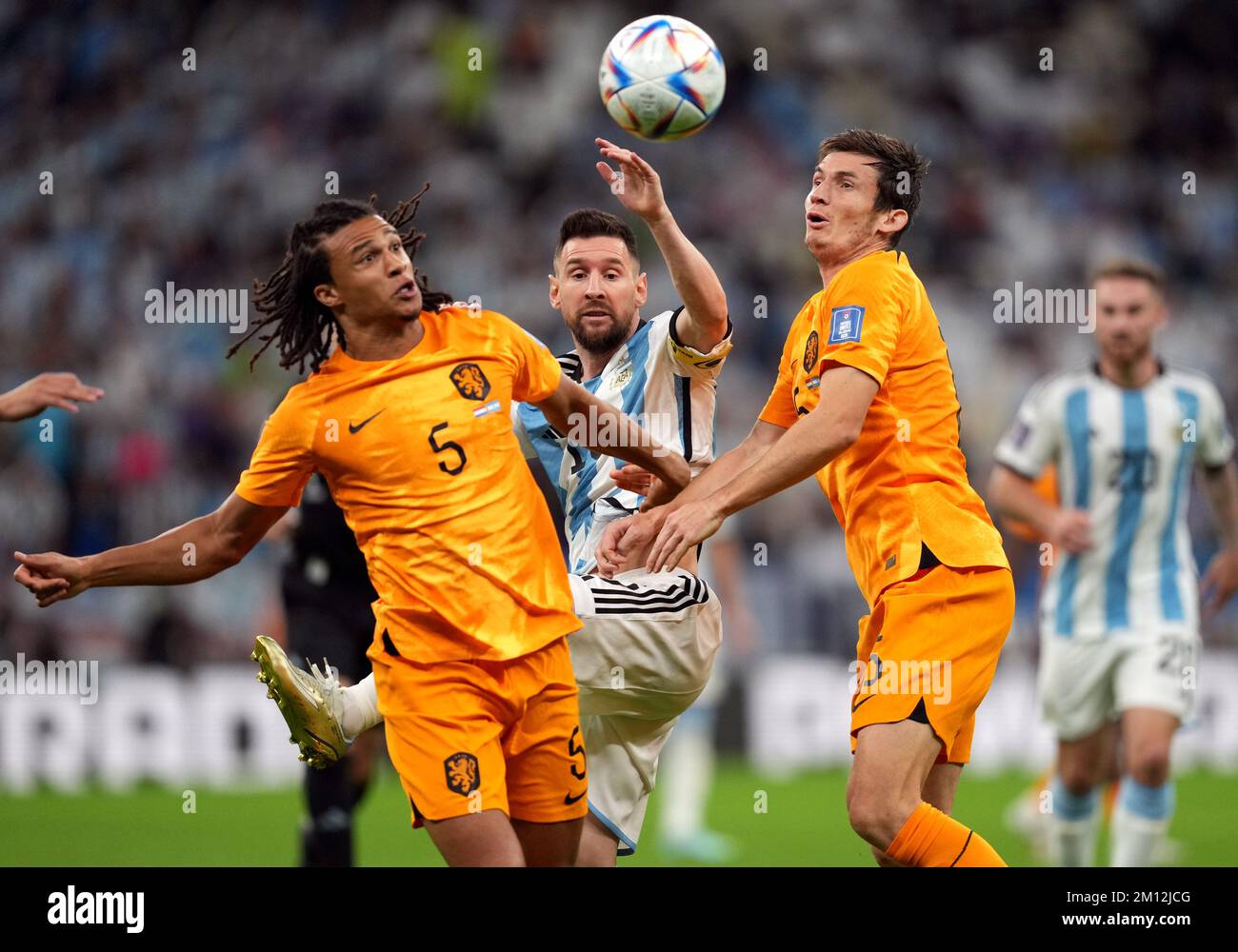 Argentina's Lionel Messi(centre) battles with Netherlands' Nathan Ake ...