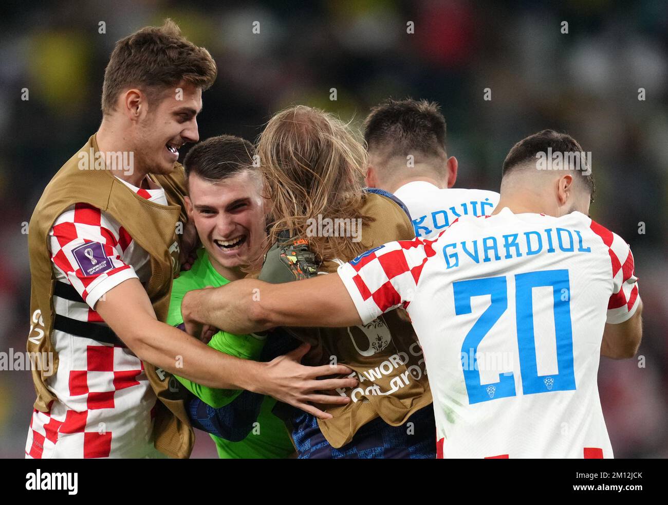 Croatia goalkeeper Dominik Livakovic surrounded by team-mates after ...