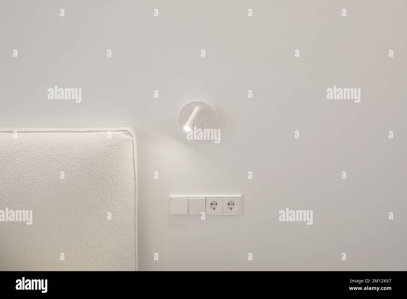 Bedside white LED wall lamp illuminating. Creative modern wall light ...