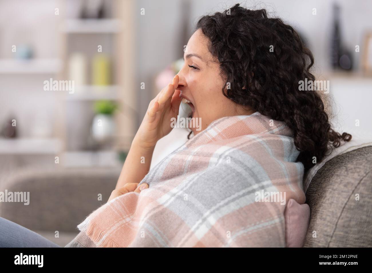 young woman at home waking up after a bad night Stock Photo - Alamy