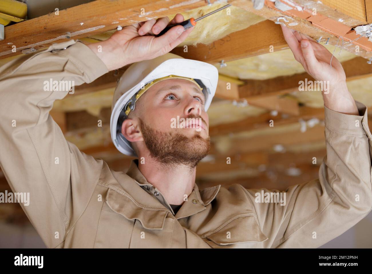 builder putting up a suspended ceiling Stock Photo - Alamy