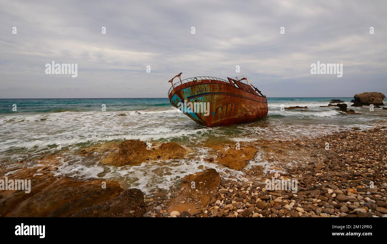 Agios Gordios, bad weather, cloudy sky, shipwreck, graffiti painting ...