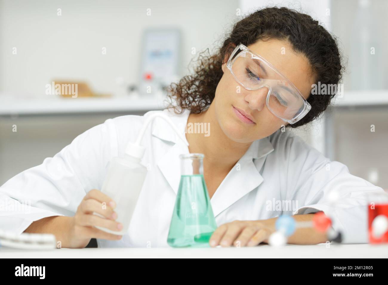 Woman during lab experiment hi-res stock photography and images - Alamy