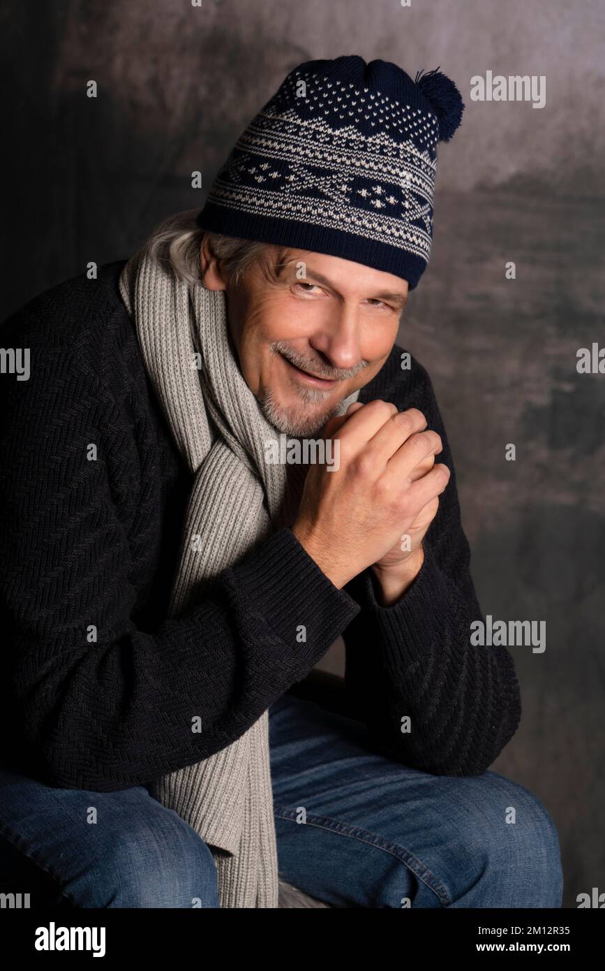 Elderly gentleman with cap and scarf Stock Photo - Alamy