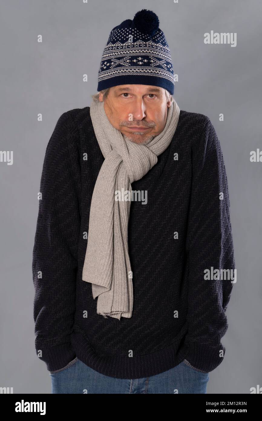 Elderly gentleman with cap and scarf, freezing Stock Photo - Alamy