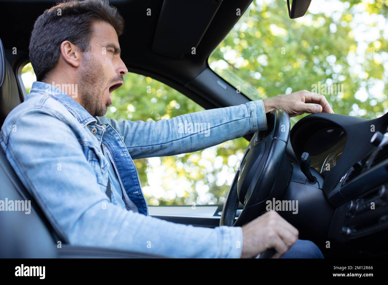 worried man travelling by car Stock Photo - Alamy