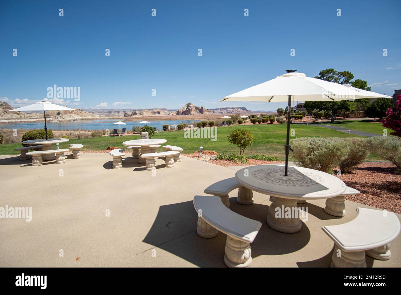 A beautiful lounge area with outdoor tables and seats near Lake Powell ...