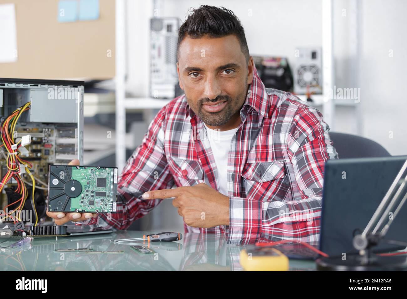 a technician repairing a computer Stock Photo - Alamy