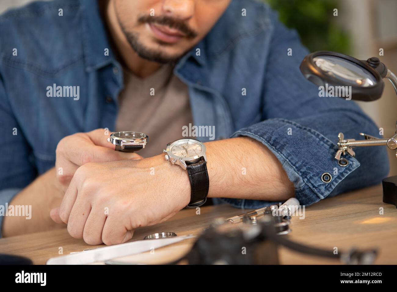 close up portrait of a watchmaker at work Stock Photo - Alamy