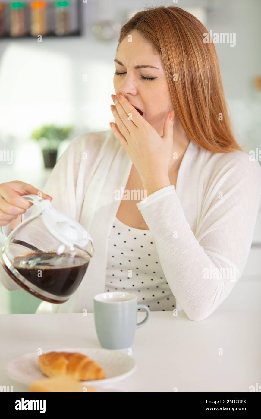 sleepy tired girl with a bad wake up Stock Photo - Alamy