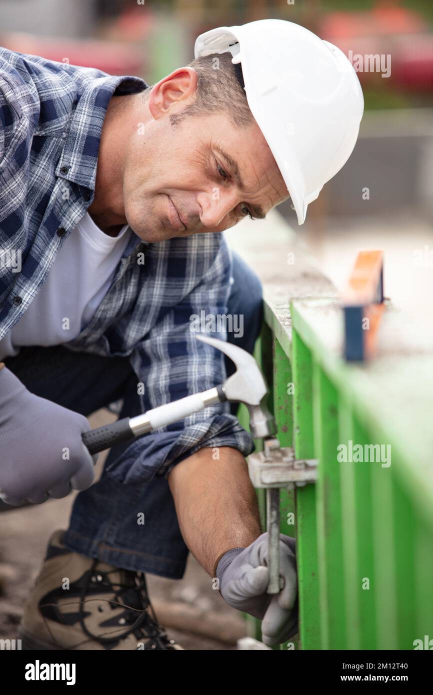 brick pathway paving by professional paver worker Stock Photo - Alamy