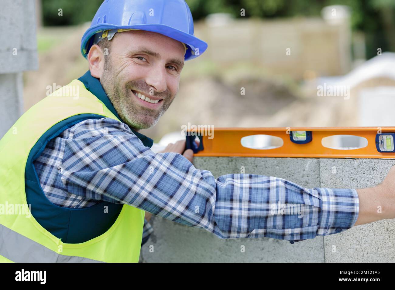 construction worker with level tool Stock Photo - Alamy