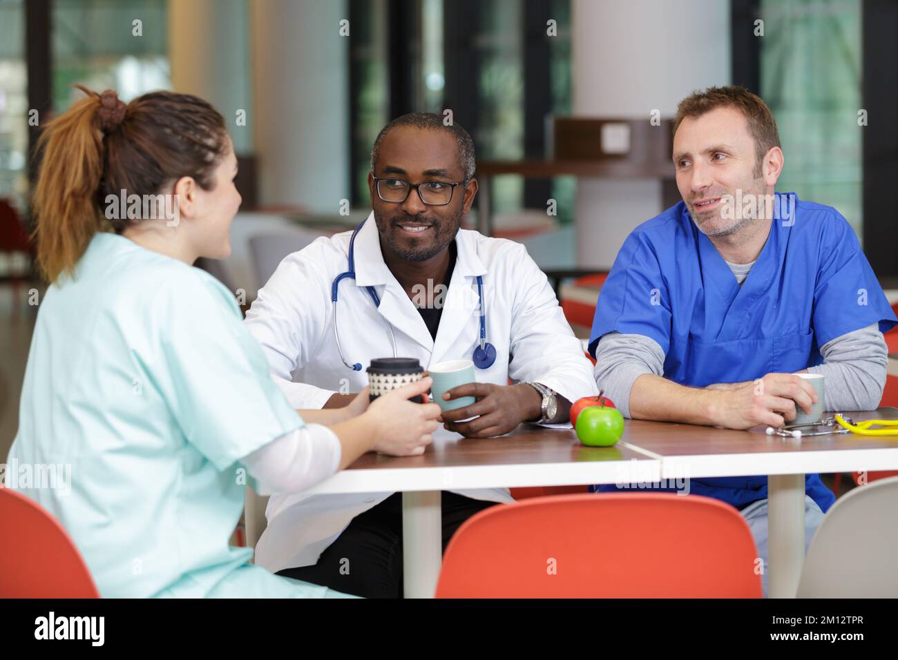 group of doctors in the cafeteria or canteen Stock Photo - Alamy