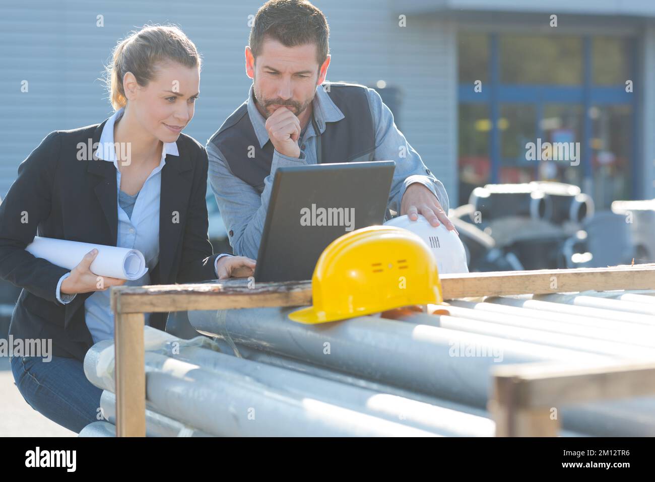 worker and female boss outside factory Stock Photo - Alamy
