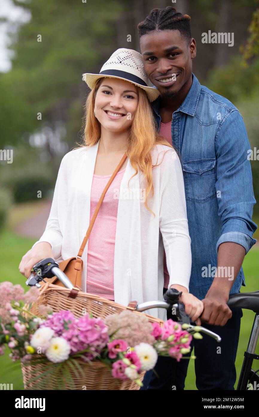 happy couple on bike ride outdoors Stock Photo - Alamy