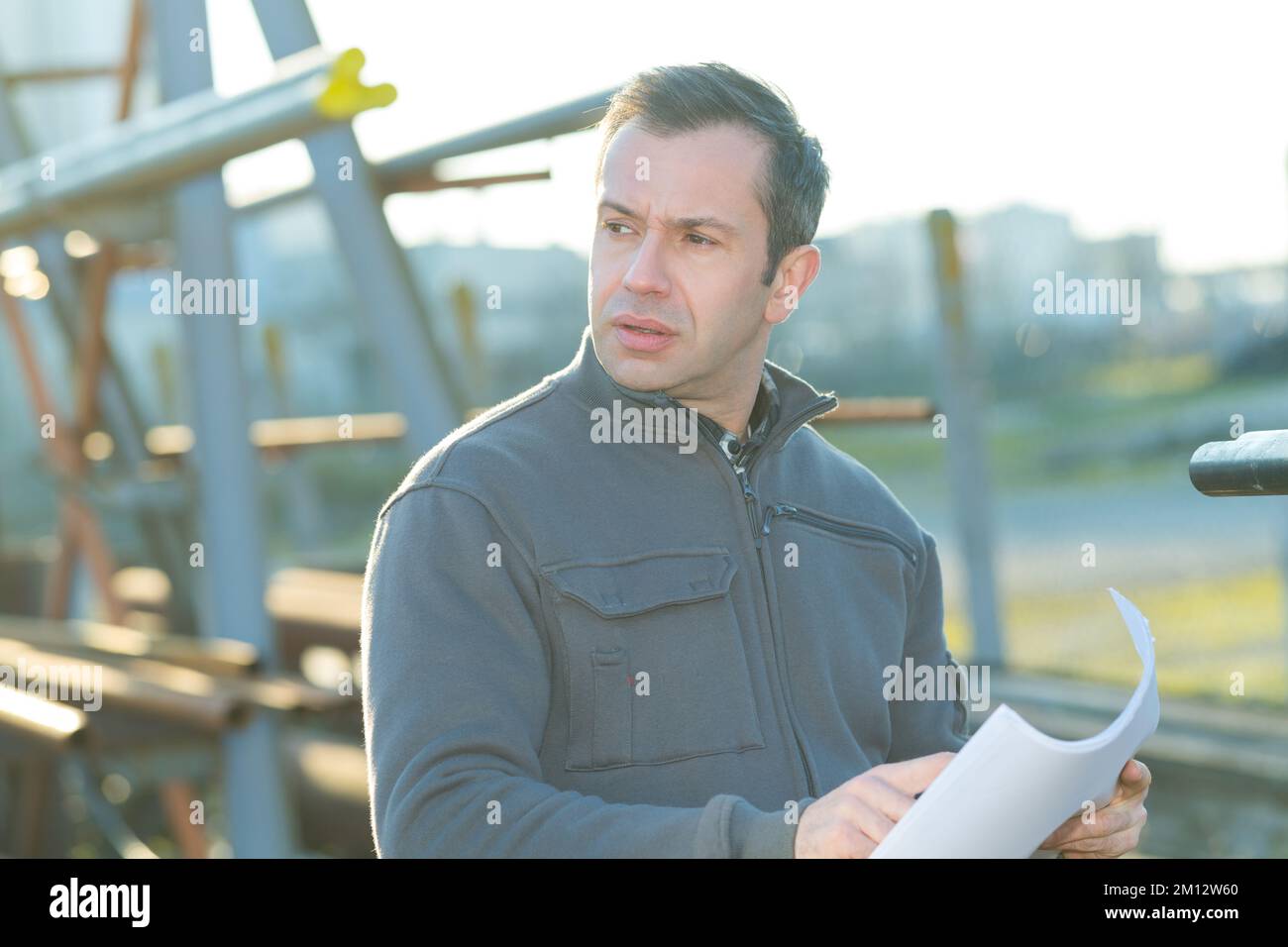 architect surveying a new building plot Stock Photo - Alamy