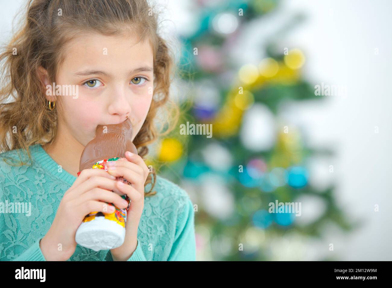 a little girl eating chocolate Stock Photo - Alamy