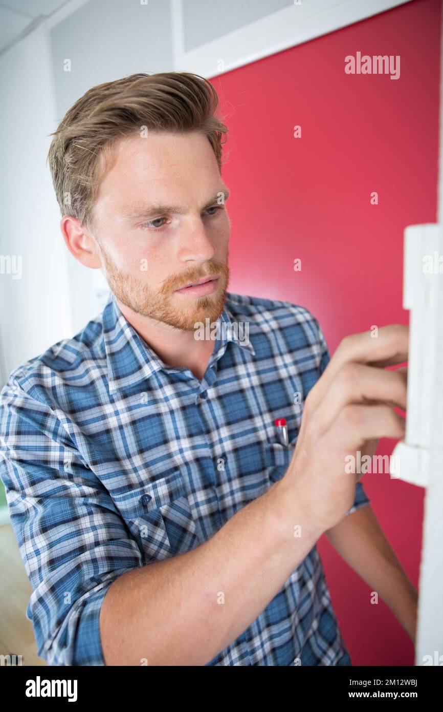 man pressing his combination pin on the locking device Stock Photo - Alamy