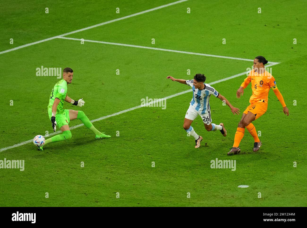 Argentina's Nahuel Molina (second right) scores their side's first goal ...