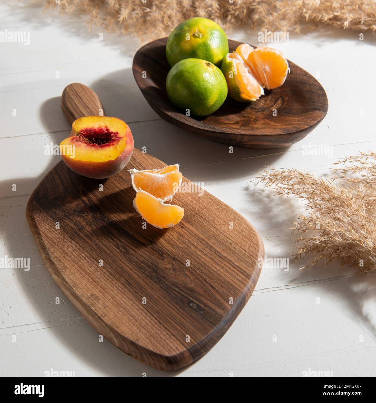 handmade wooden boards with fruits on table Stock Photo - Alamy