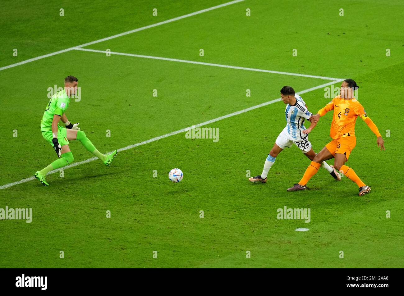 Argentina's Nahuel Molina (second right) scores their side's first goal ...