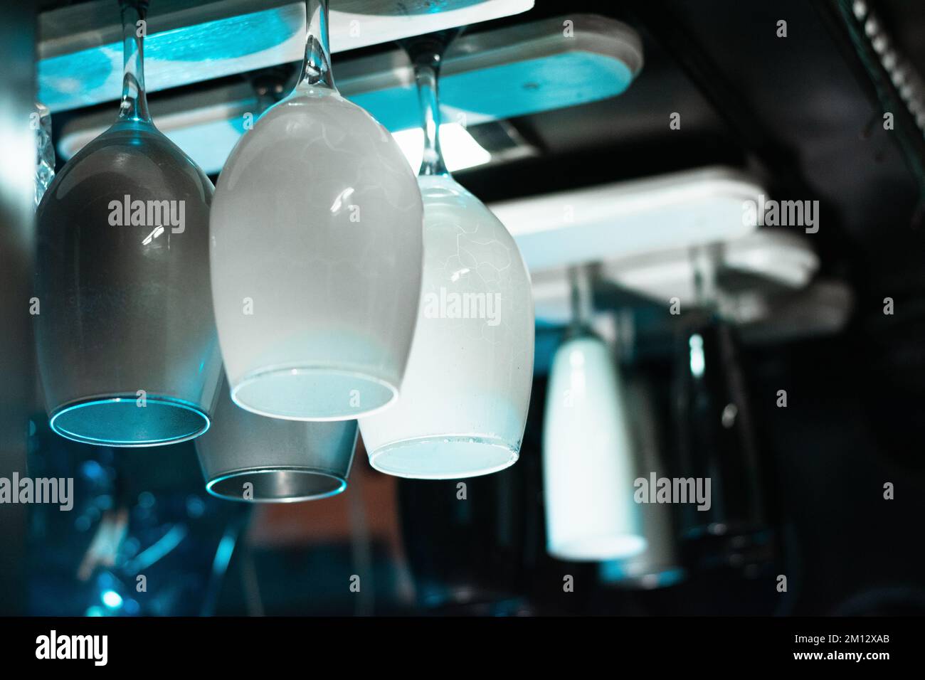 close-up of a white glass, placed on the top of a liquor display case ...
