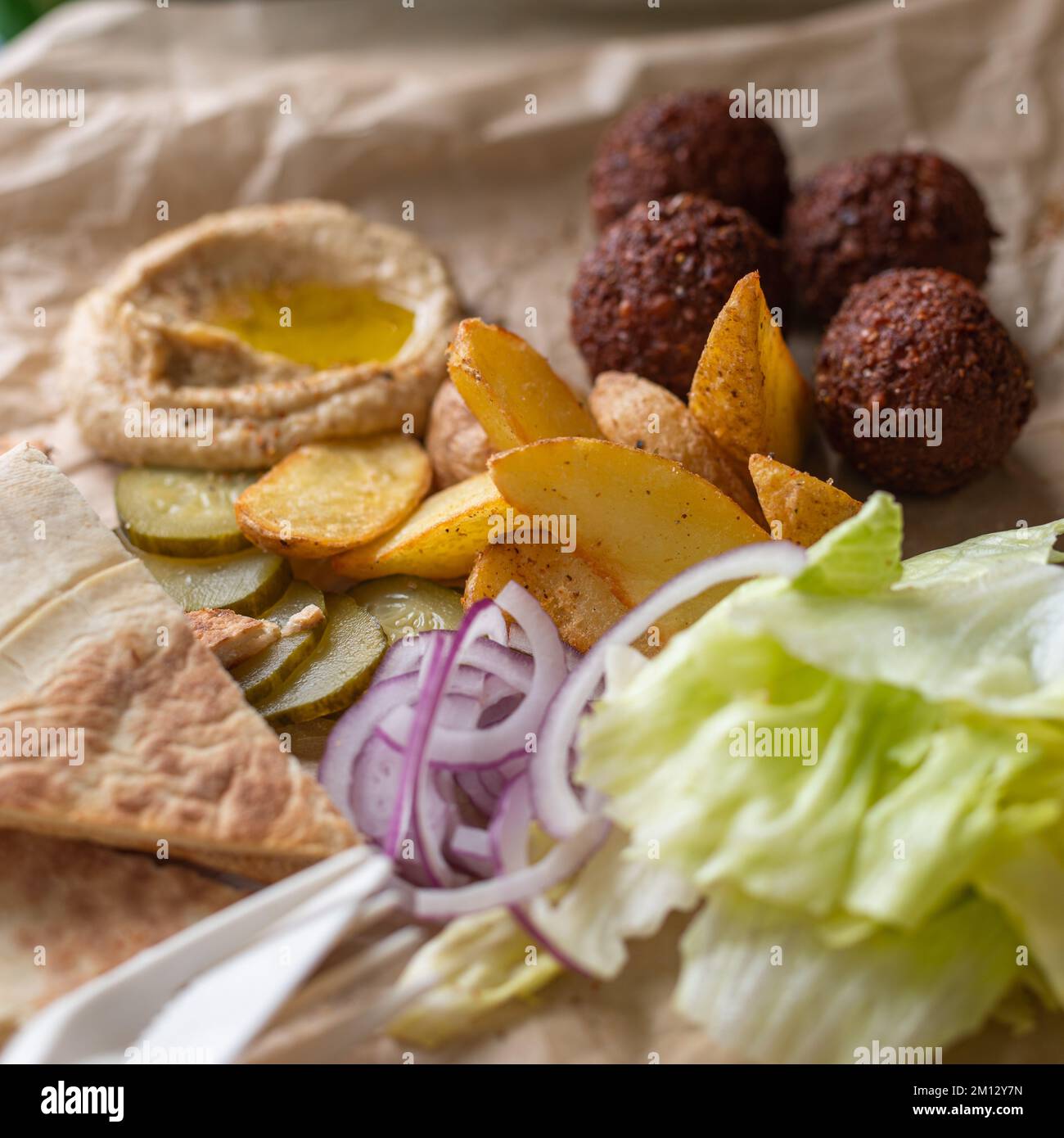 Large set of falafel, rustic potatoes, cheese sticks, chicken nuggets ...