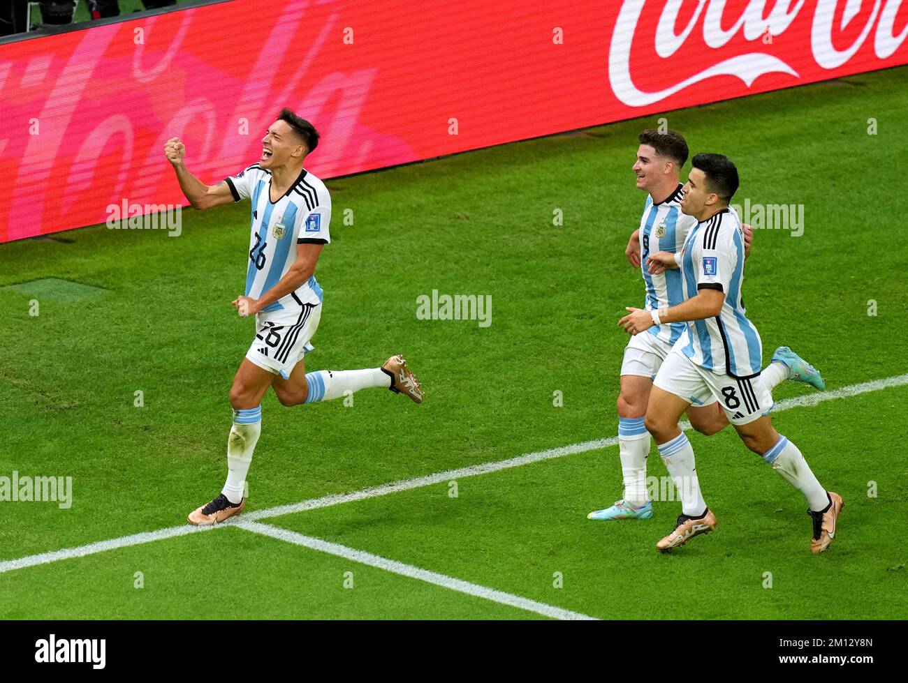 Argentina's Nahuel Molina (left) celebrates scoring their side's first ...