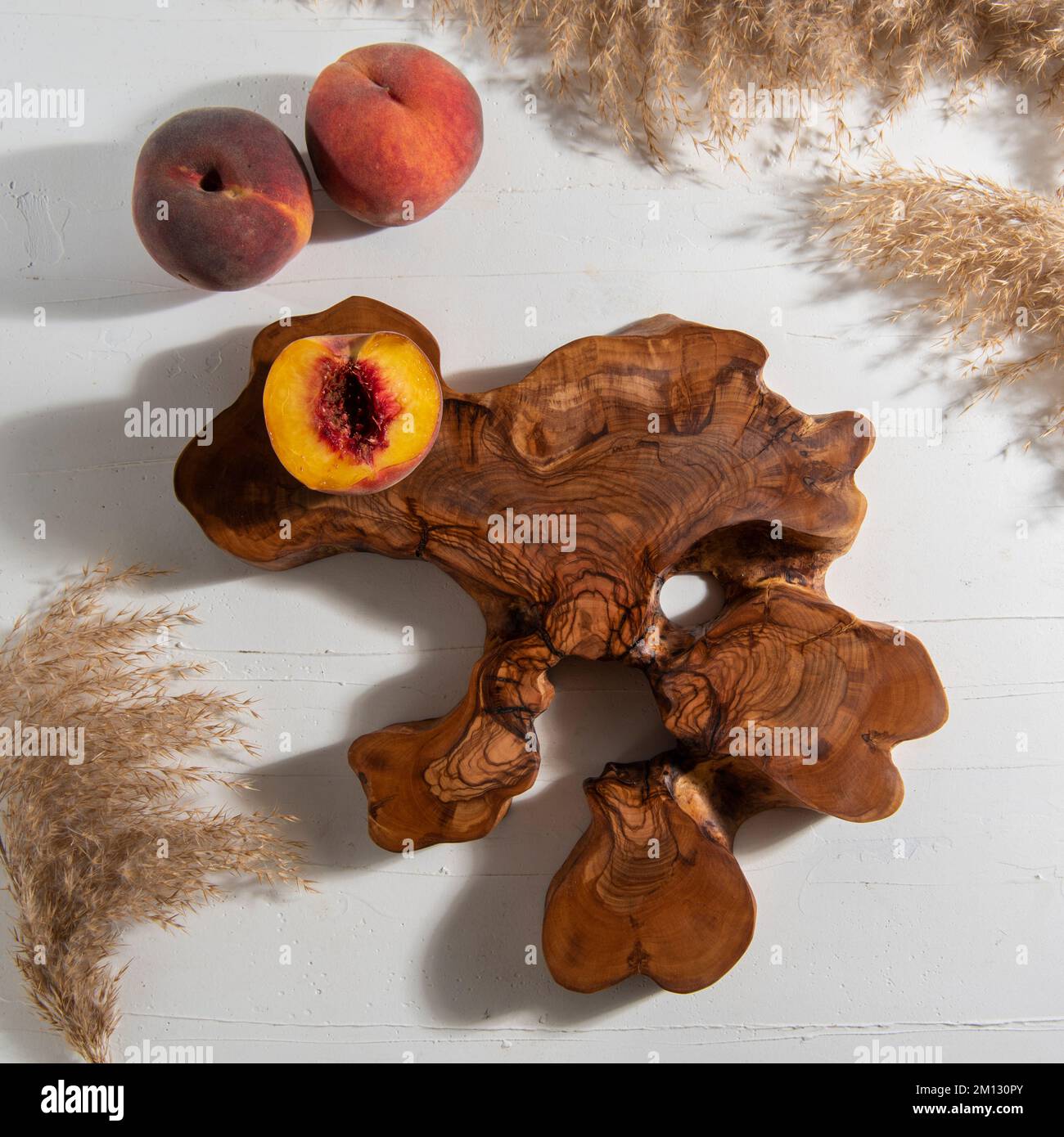 handmade wooden boards with peach on a table Stock Photo - Alamy