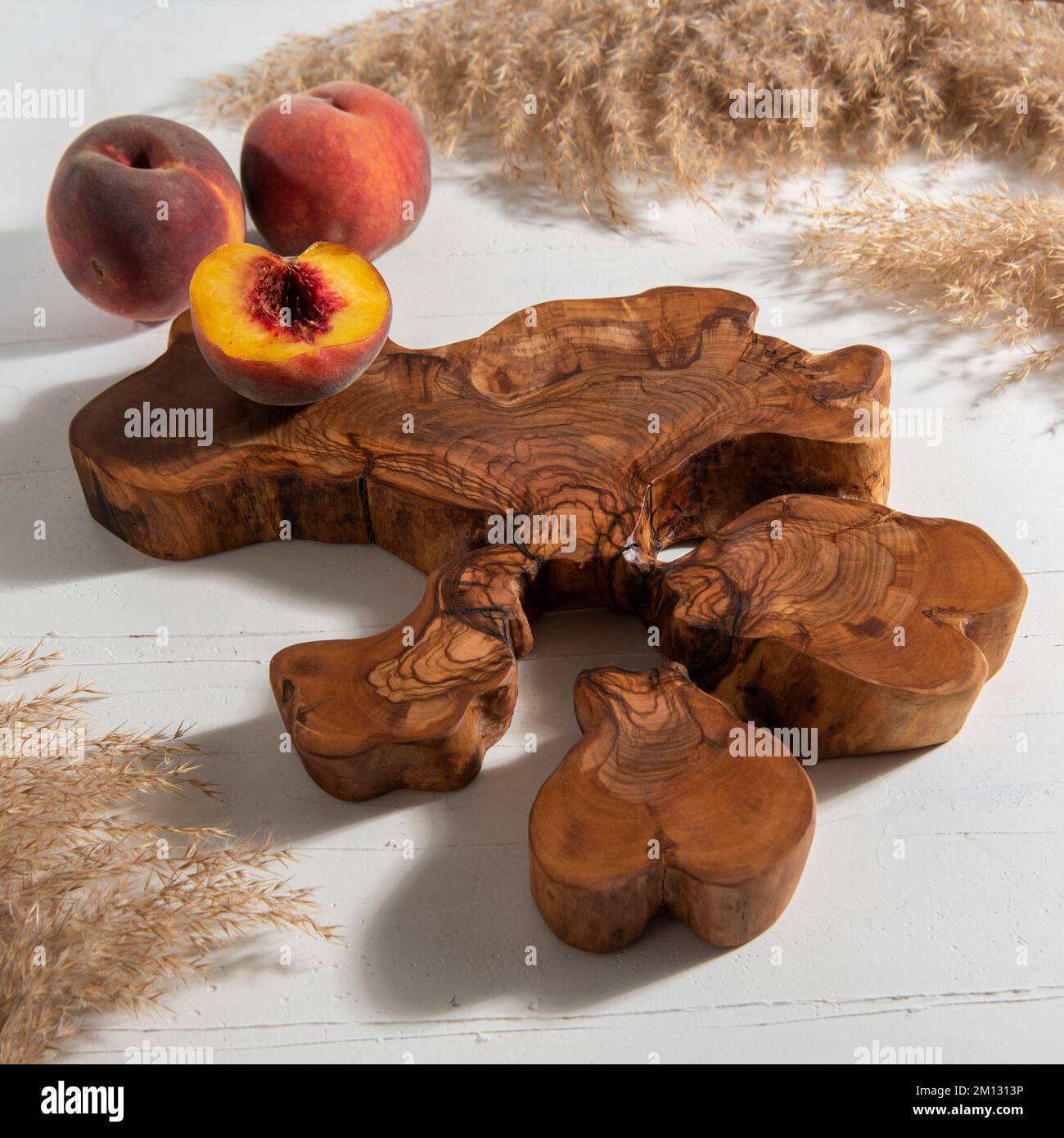 handmade wooden boards with peach on a table Stock Photo - Alamy