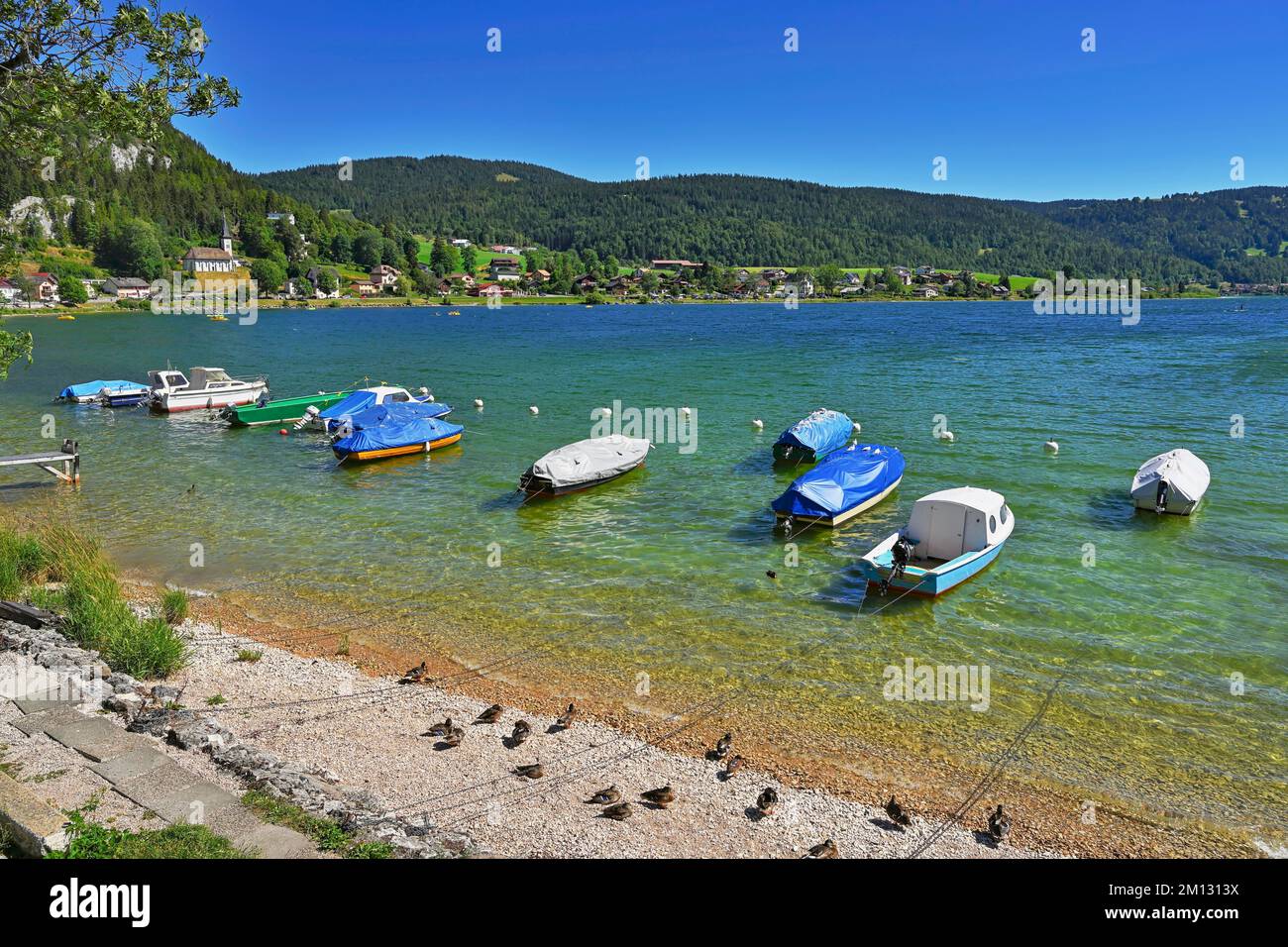 Boats on the shore of Lac de Joux, Le Pont, Canton Vaud, Switzerland ...