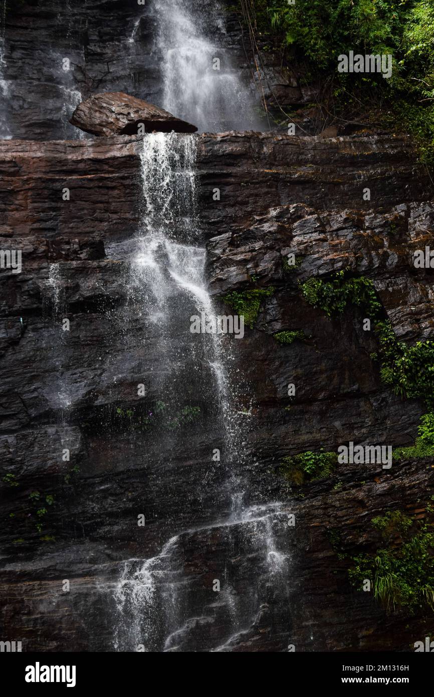 A vertical shot of Jhari falls in Chikmagalur district in Karnataka ...