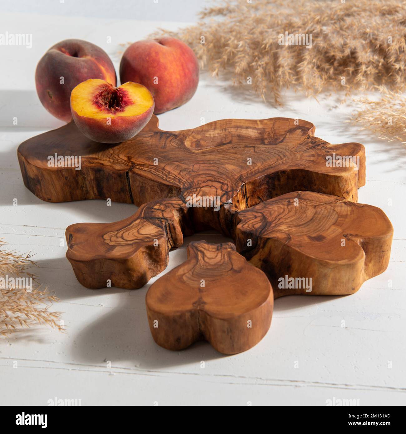 handmade wooden boards with peach on a table Stock Photo - Alamy