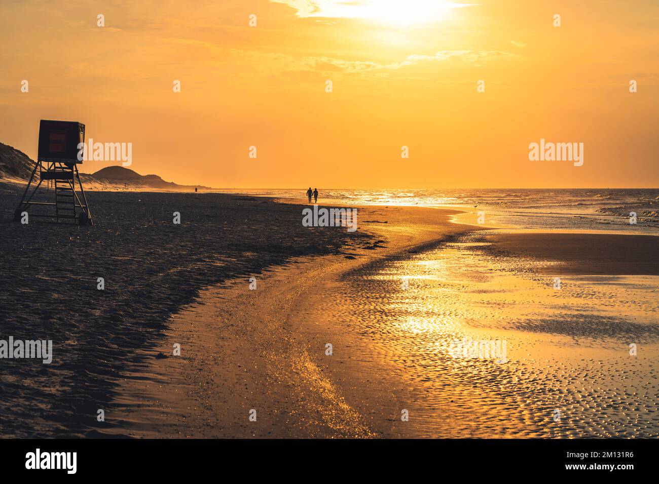 Evening atmosphere on the North Sea beach at low tide, in the distance ...