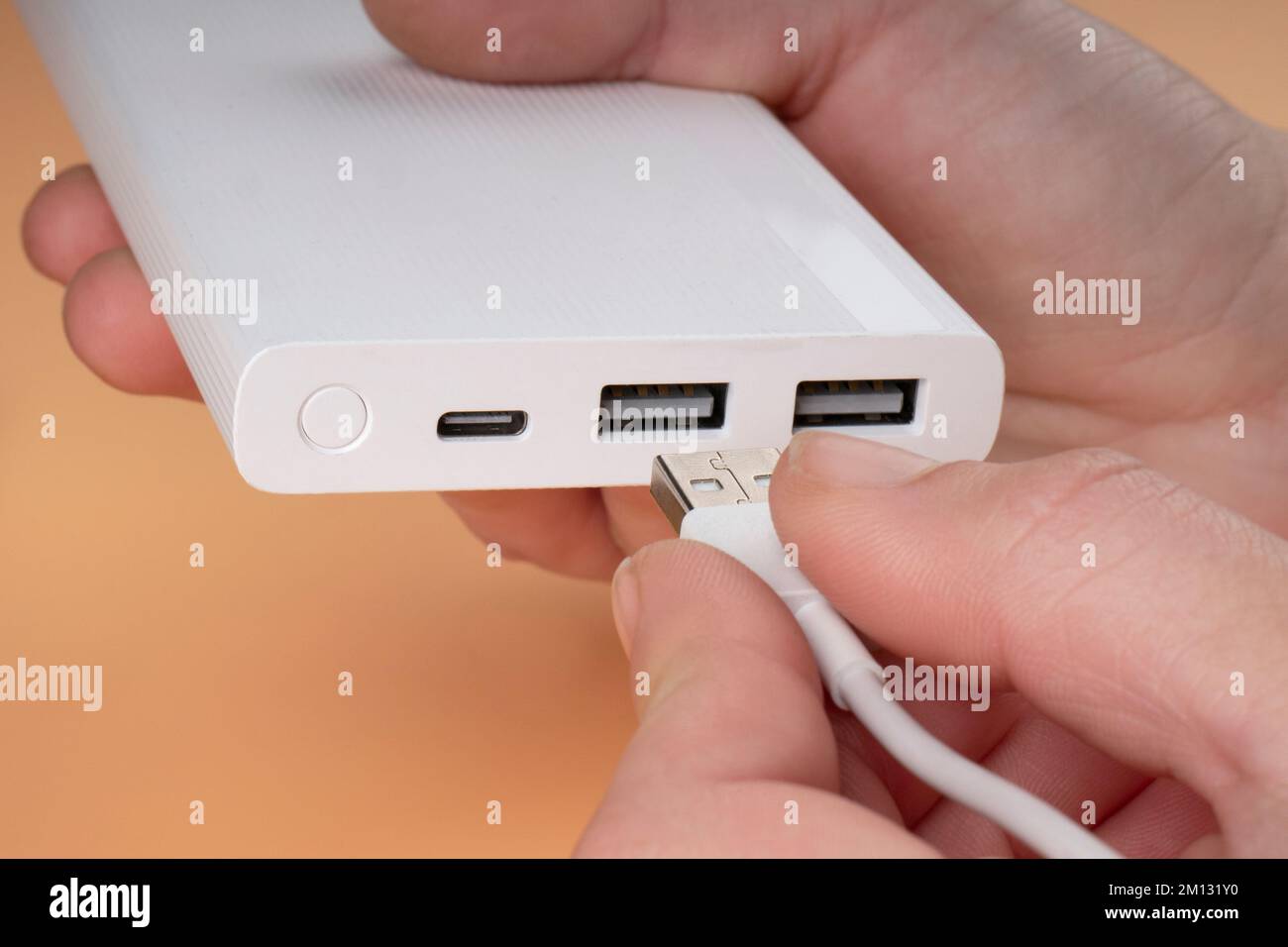 hand connect usb for white portable power bank Stock Photo - Alamy