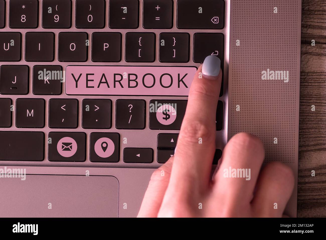 Sign displaying Yearbook. Word for publication compiled by graduating ...