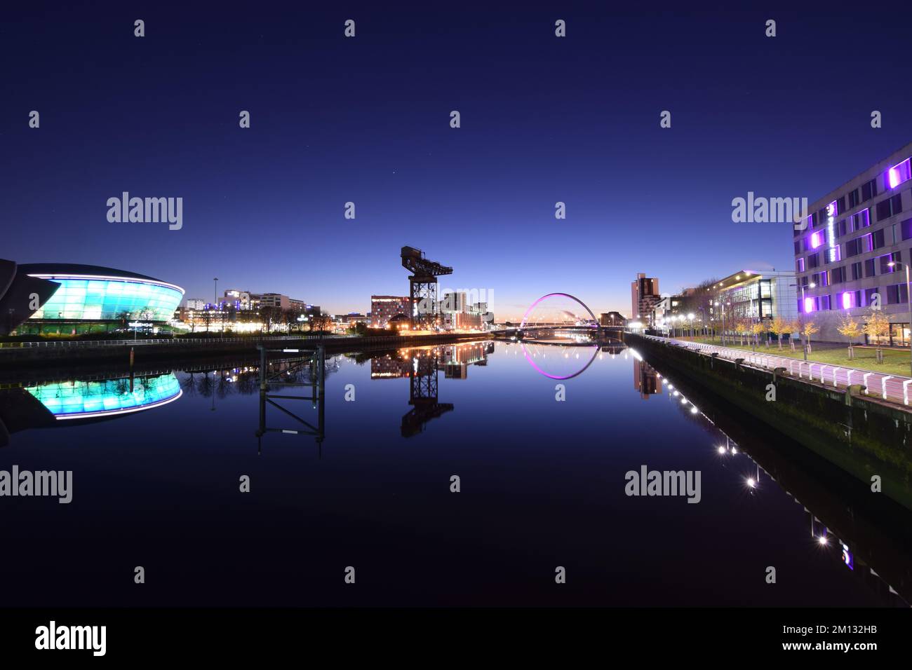 The reflection of the lightened building of OVO Hydro and other ...