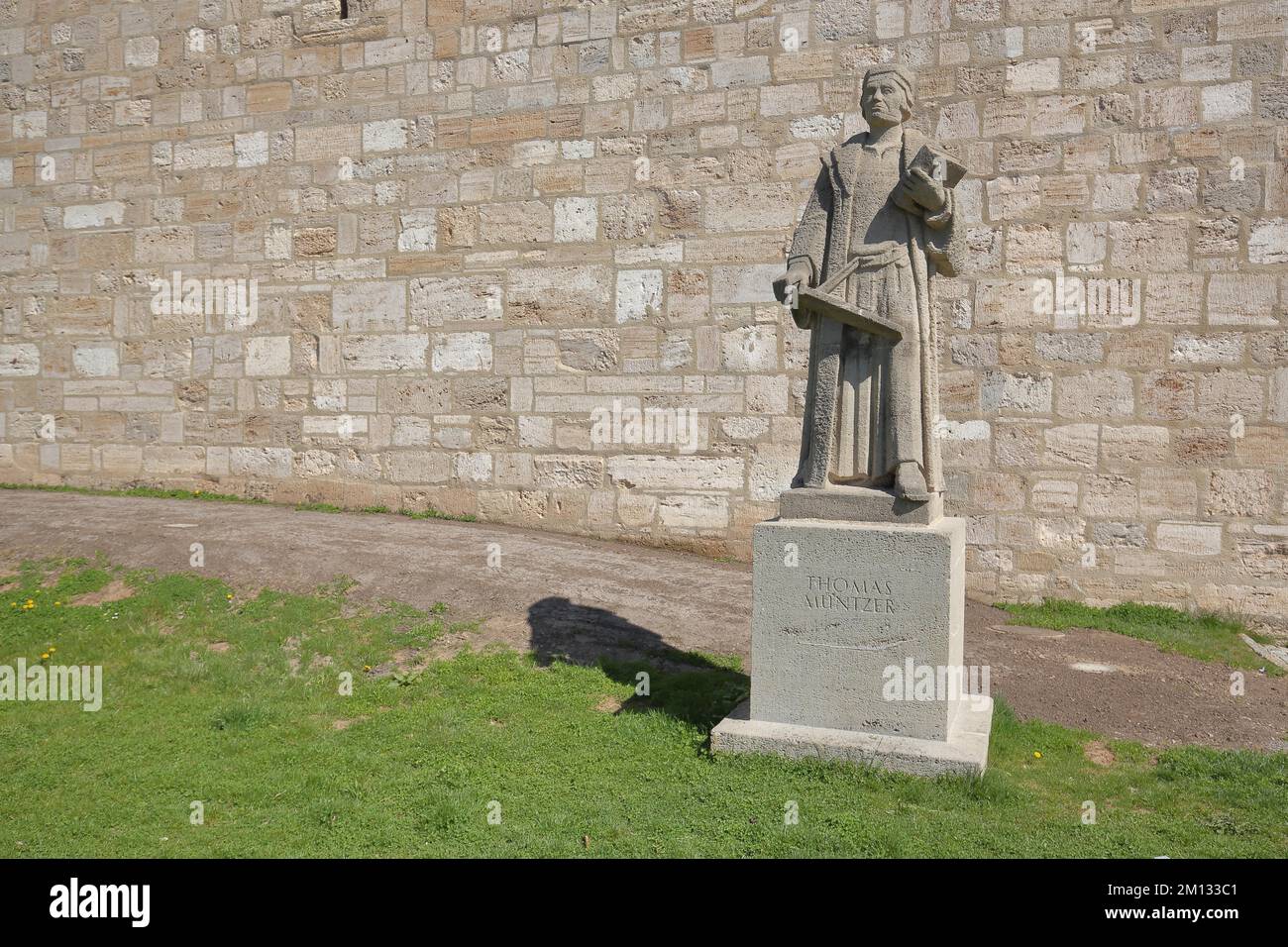 Monument and statue by Thomas Münzter with book, Mühlhausen, Thuringia ...