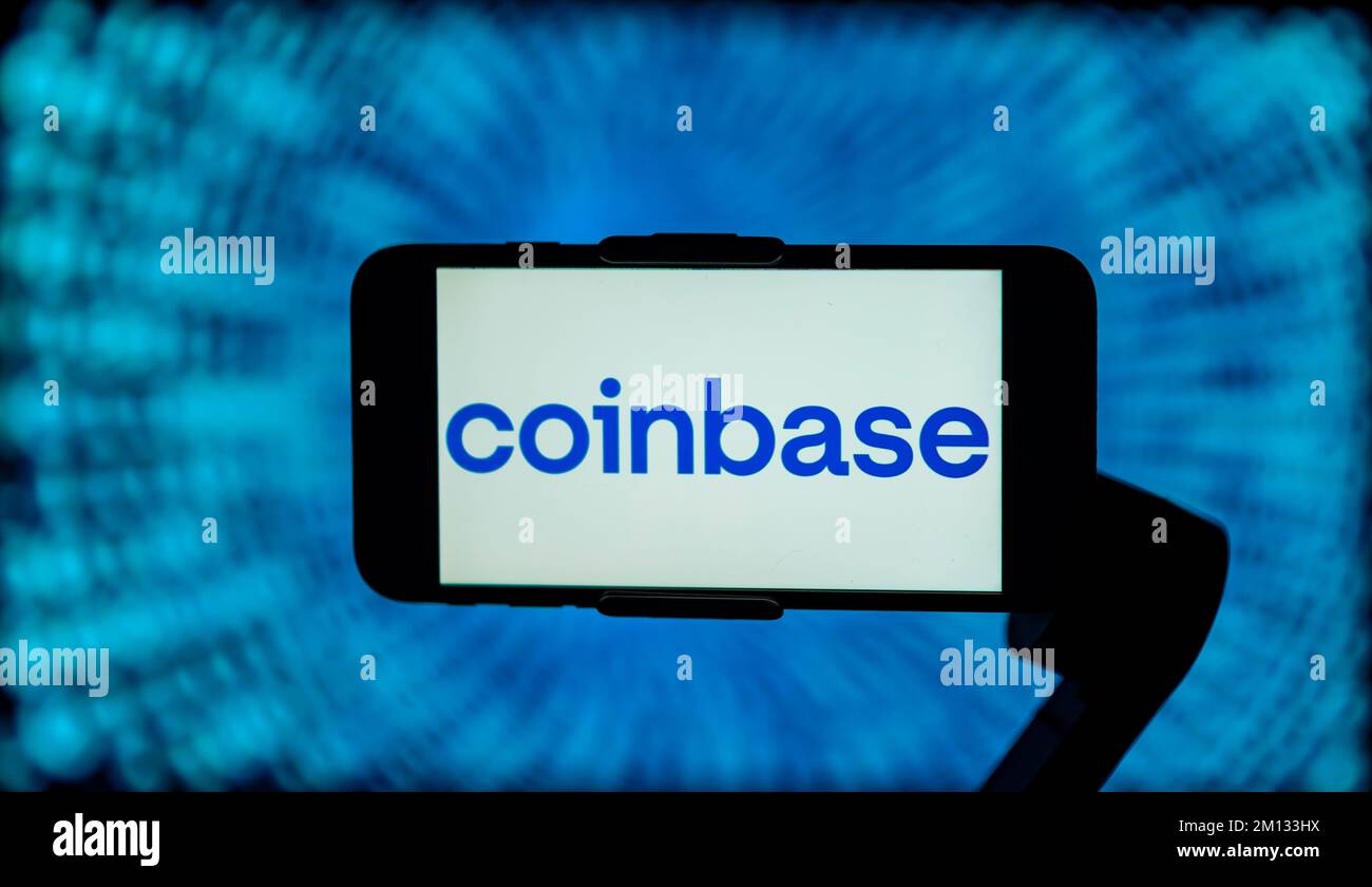 In this photo illustration, the logo of Coinbase is seen displayed on a ...
