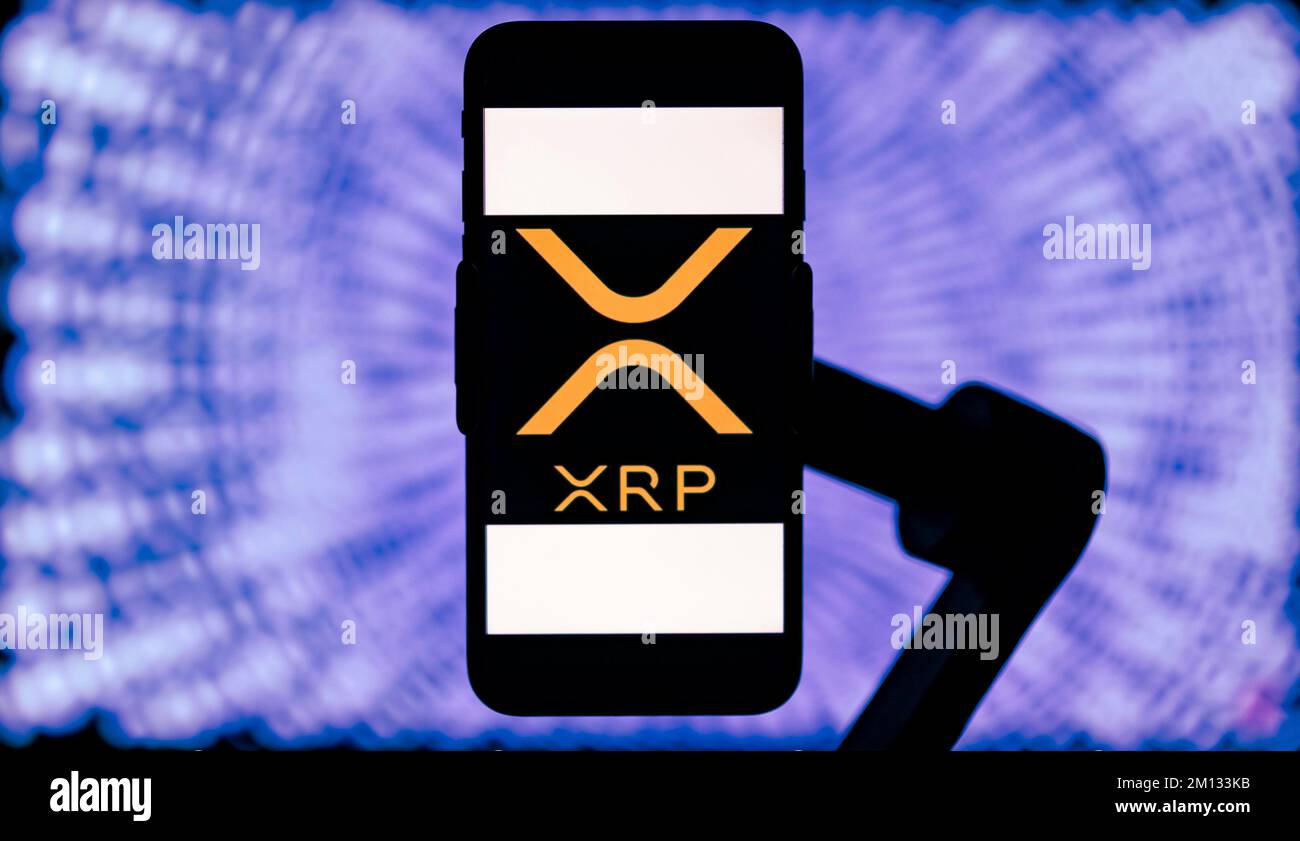 In this photo illustration, the logo of Ripple (XRP) is seen displayed ...
