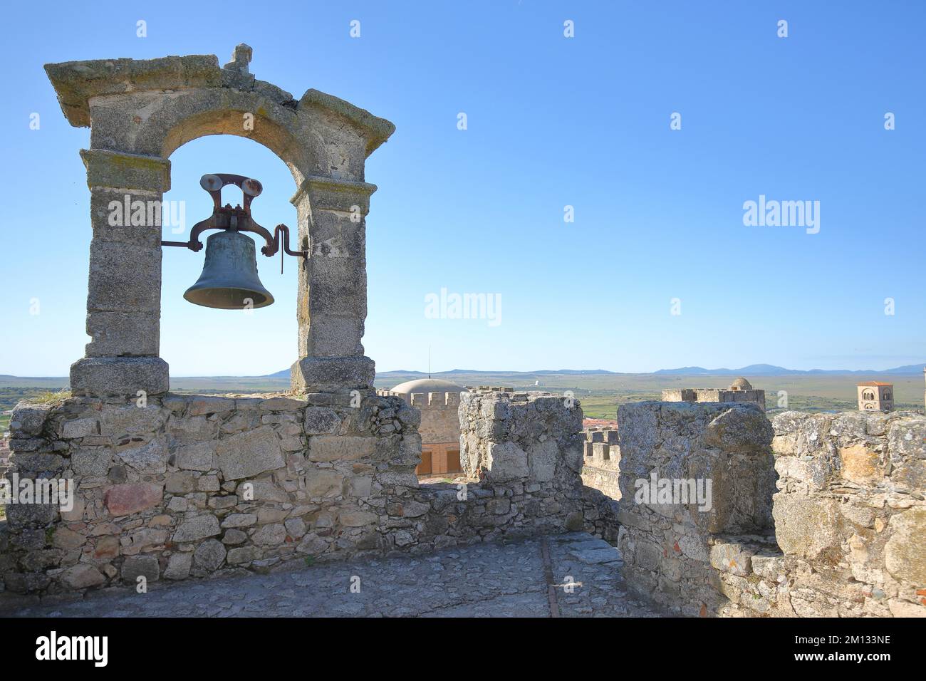 Bell gable with battlements and stone walls at the castillo, bell tower ...