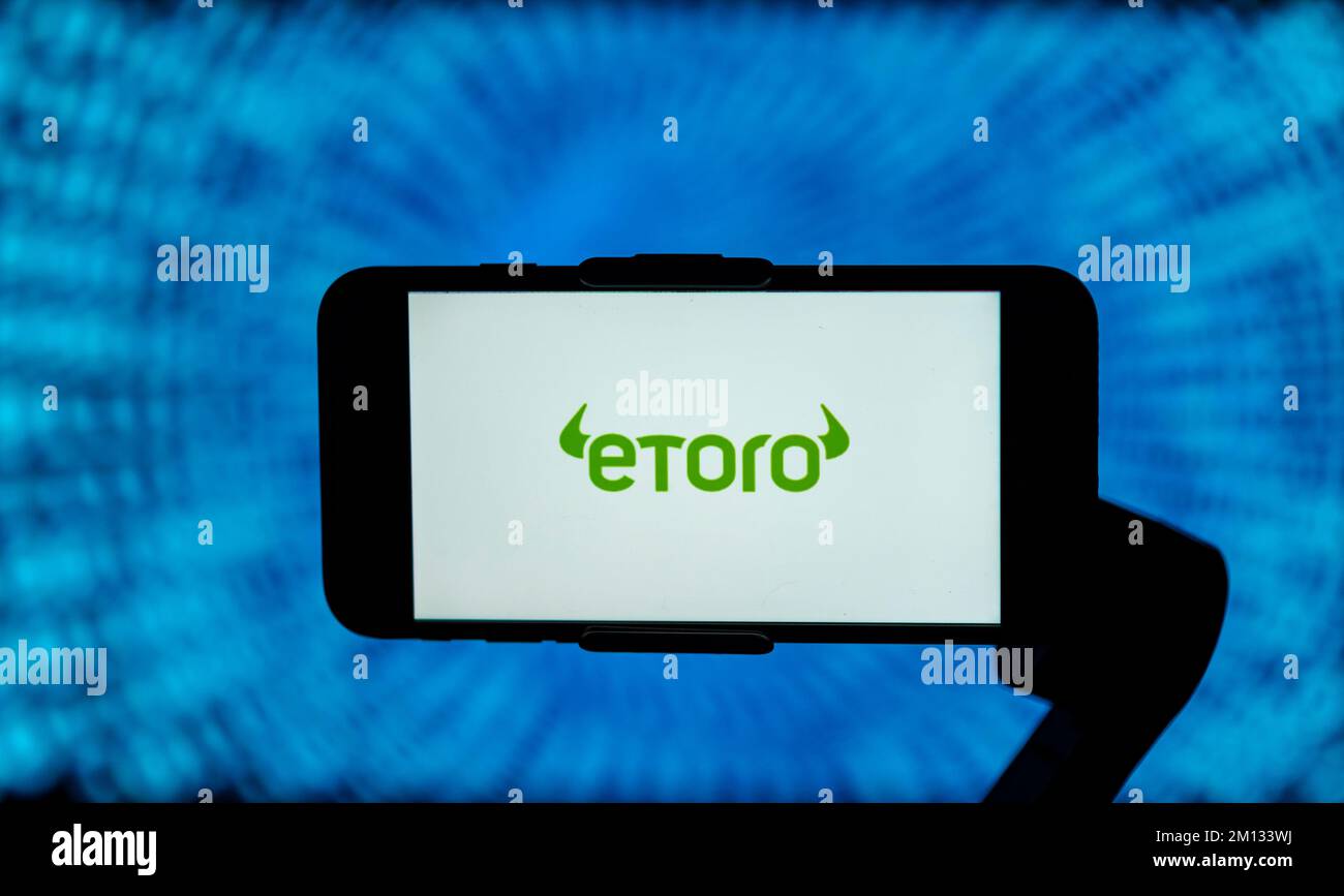 In this photo illustration, the logo Etoro of is seen displayed on a ...