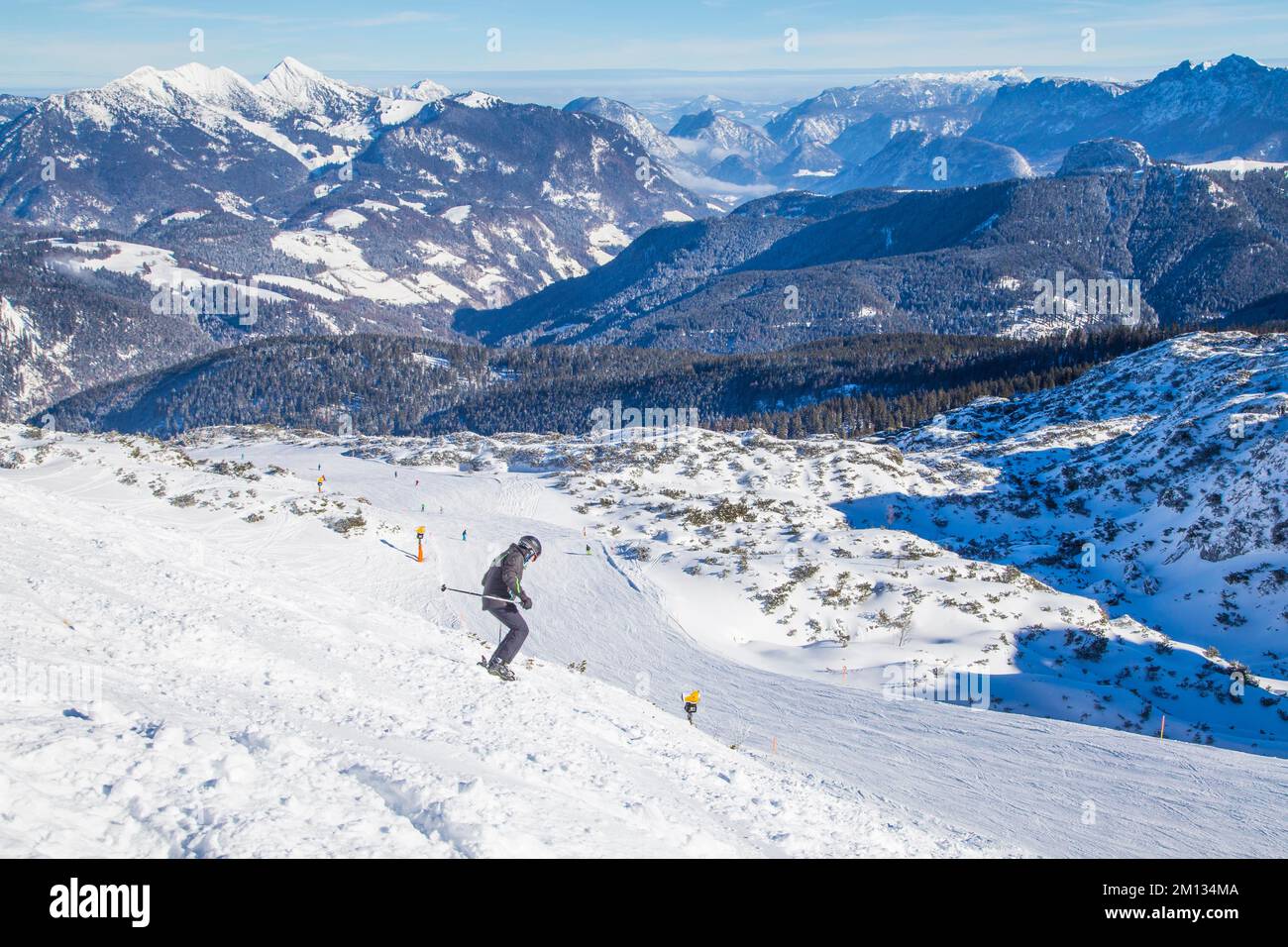 Skiers in the terrain above the Steinberg downhill run, Steinplatte ski ...
