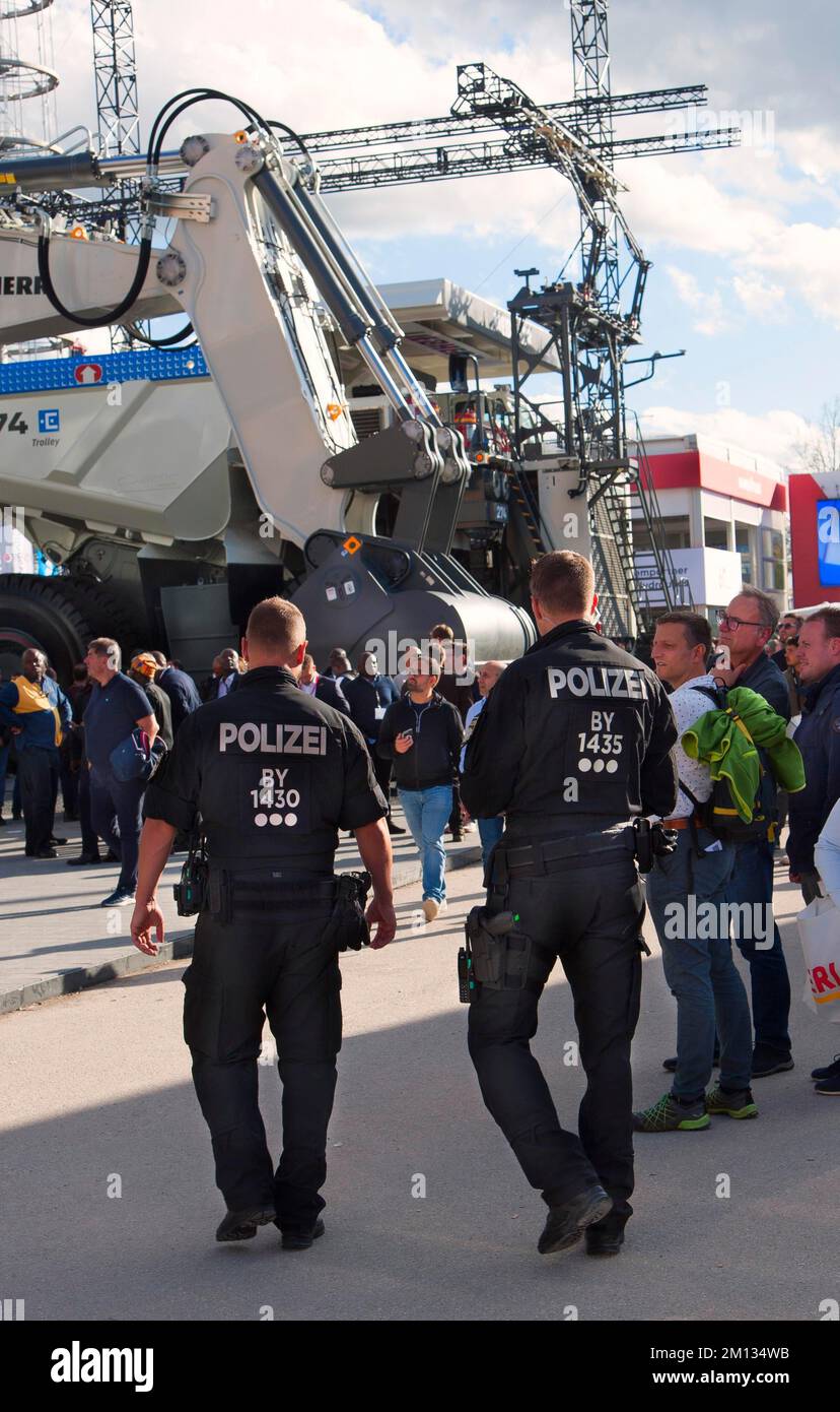 Two police officers help and advise at the trade fair grounds, Bauma ...